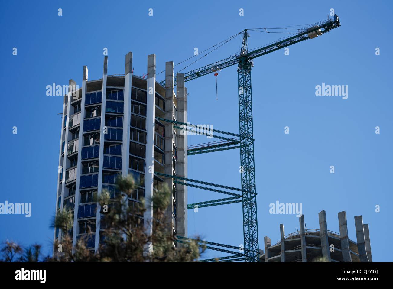 Residential multi-storey building constructed using crane Stock Photo ...