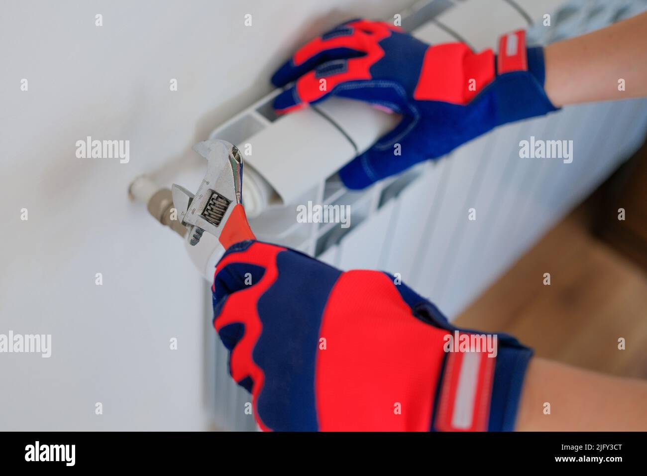 Plumber installation radiator hi-res stock photography and images - Alamy