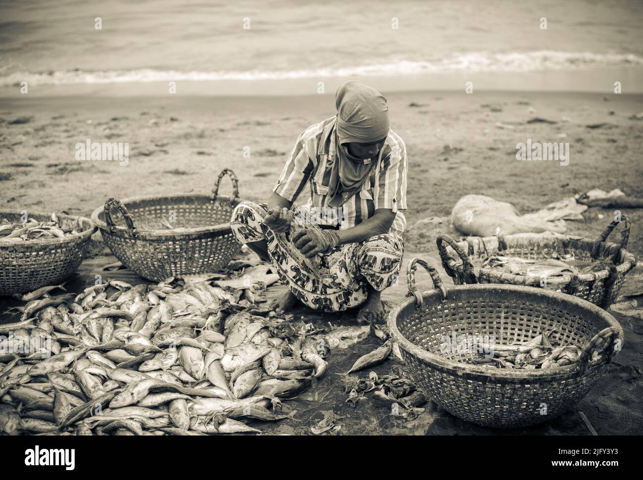 Fisherman and fish Stock Photo - Alamy