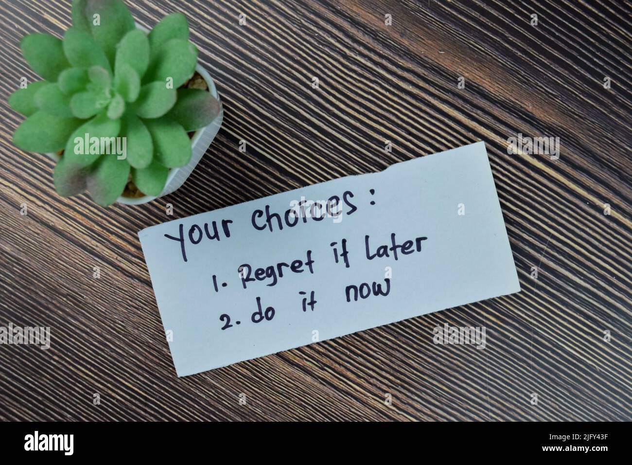 Concept of your choices - regret it later or do it now write on sticky ...