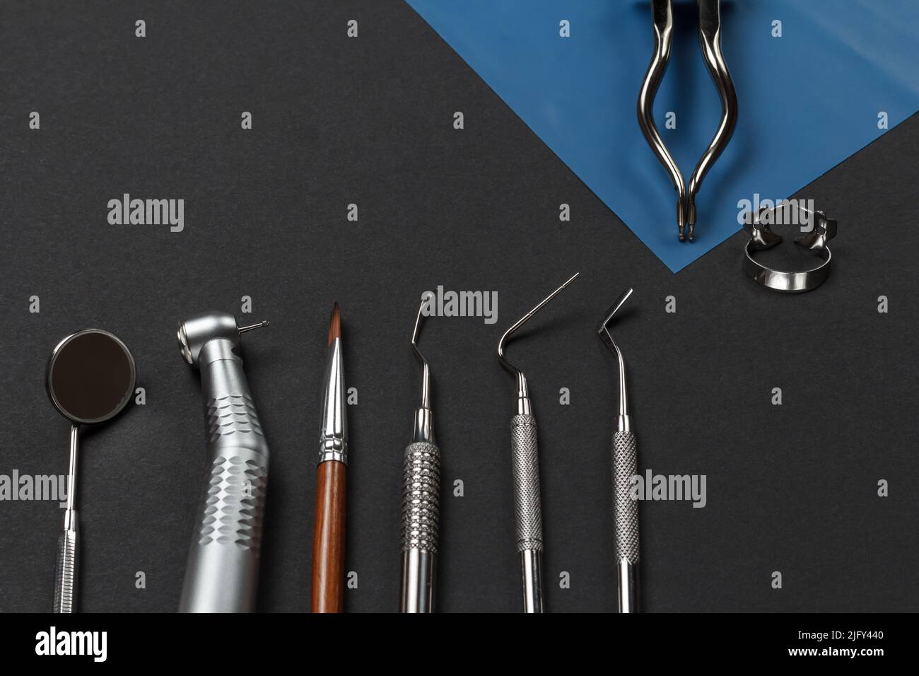 Mouth mirror, a dental handpiece, a brush, a curette, a plugger, a ...