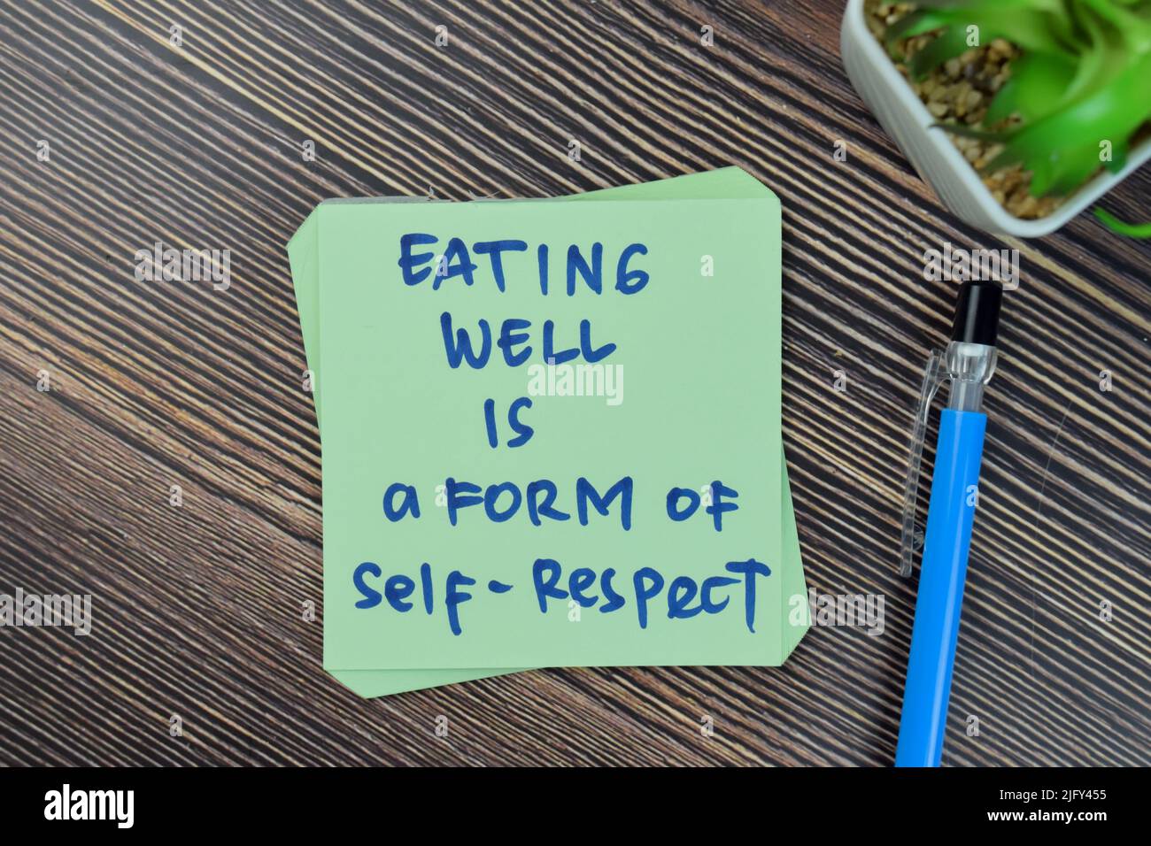 Concept of Eating well is a form of self-respect write on sticky notes ...