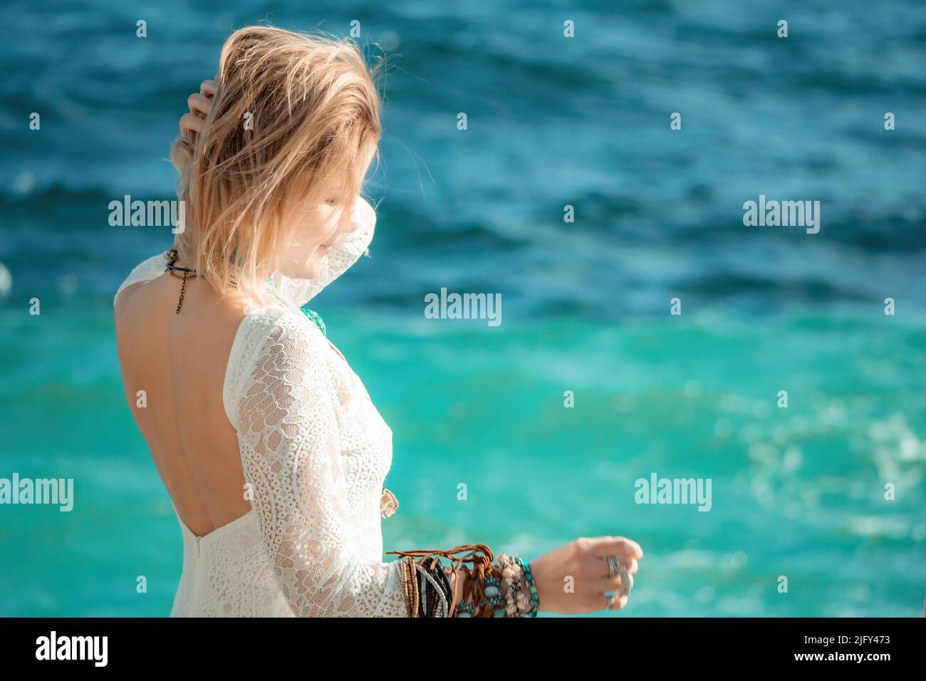 Woman in bohemian clothing on beach at sunset. Boho style for ...