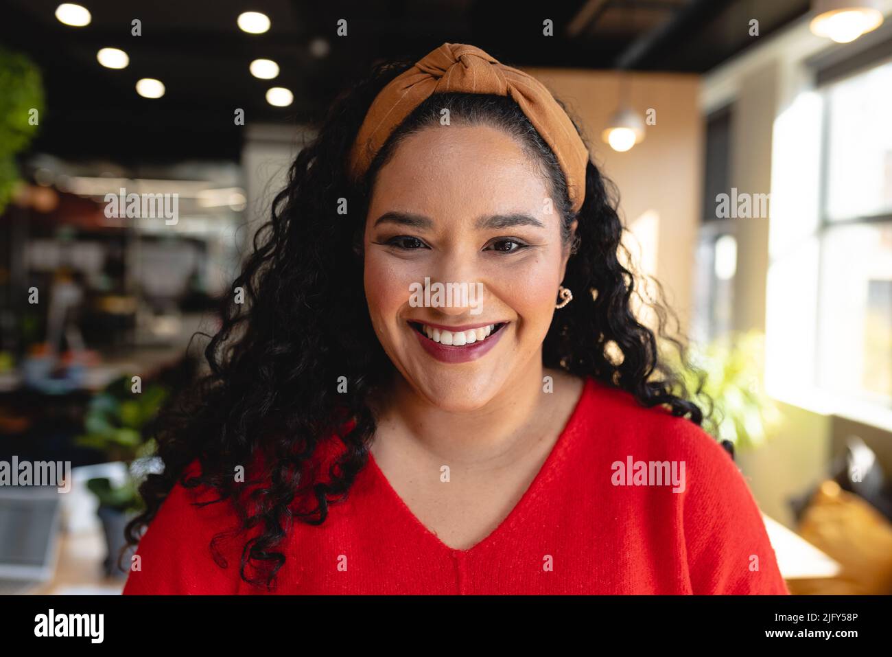 Portrait happy biracial creative businesswoman hi-res stock photography ...