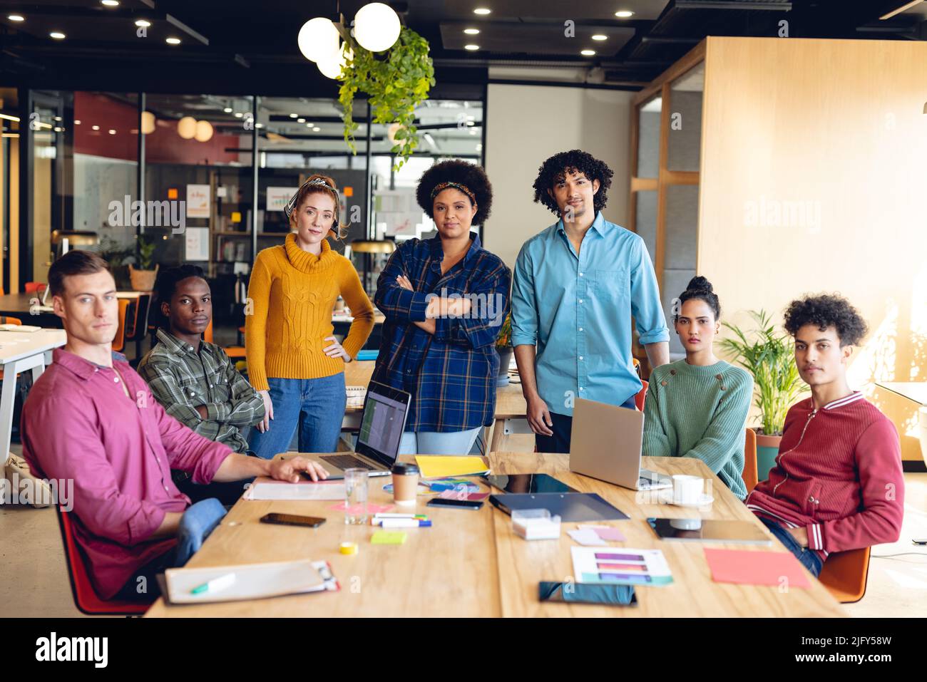 Portrait of confident multiracial design professionals in creative ...