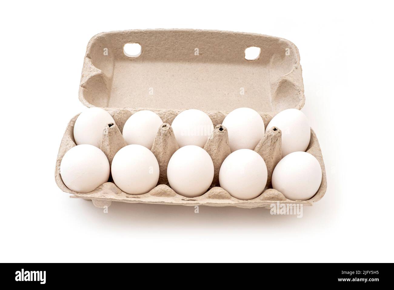 Top view of a ten chicken eggs in cardboard package isolated on white ...