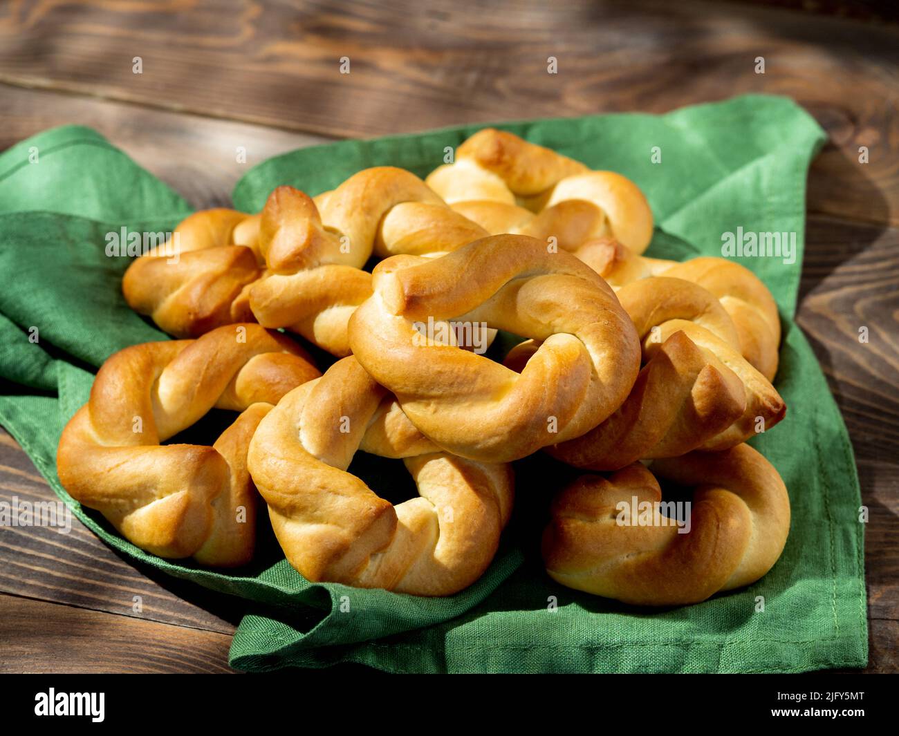 Taralli twist on wooden background. Typical italian ring-shaped or ...