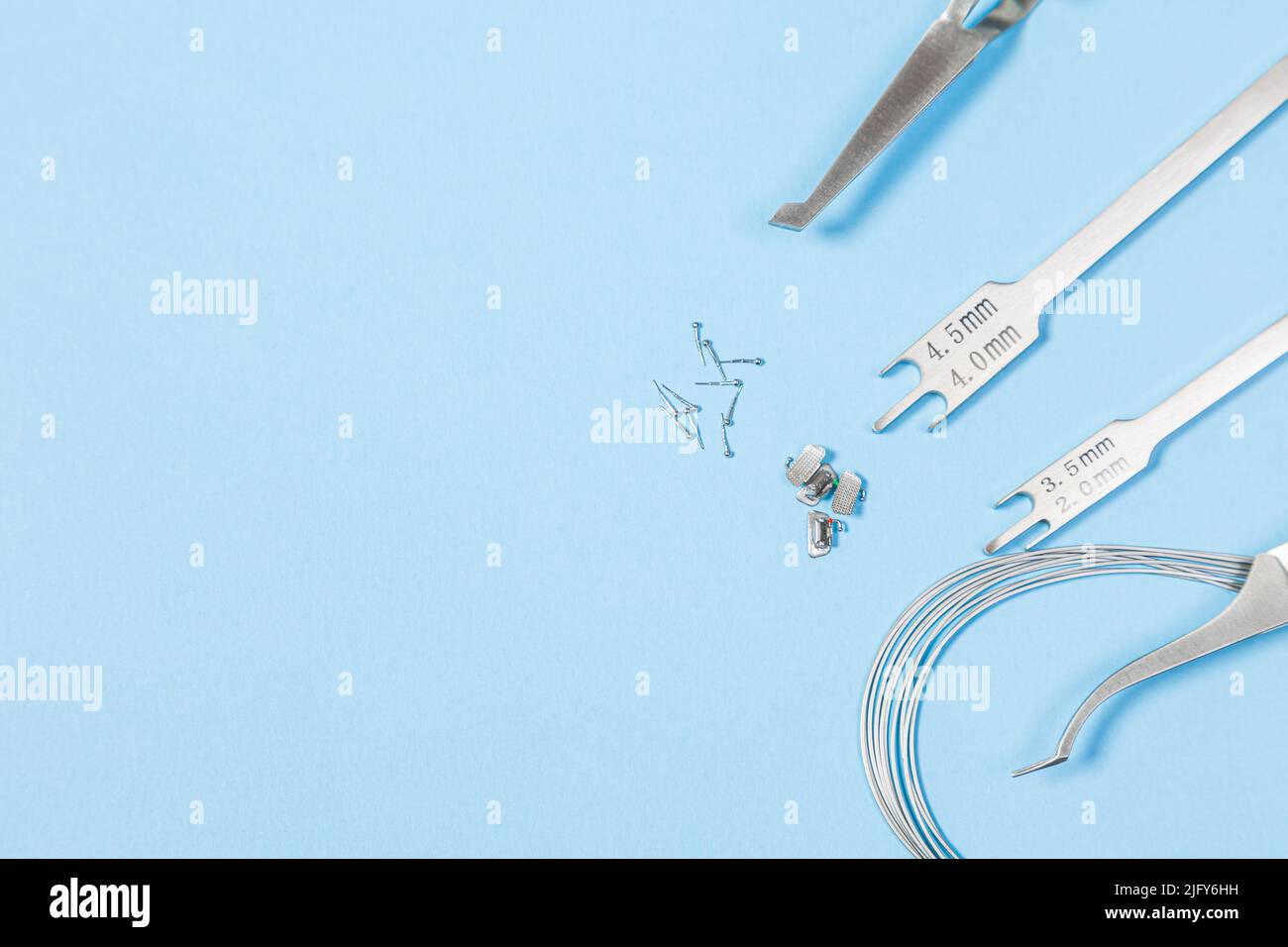 a set of special tools for an orthodontist to install braces for a ...