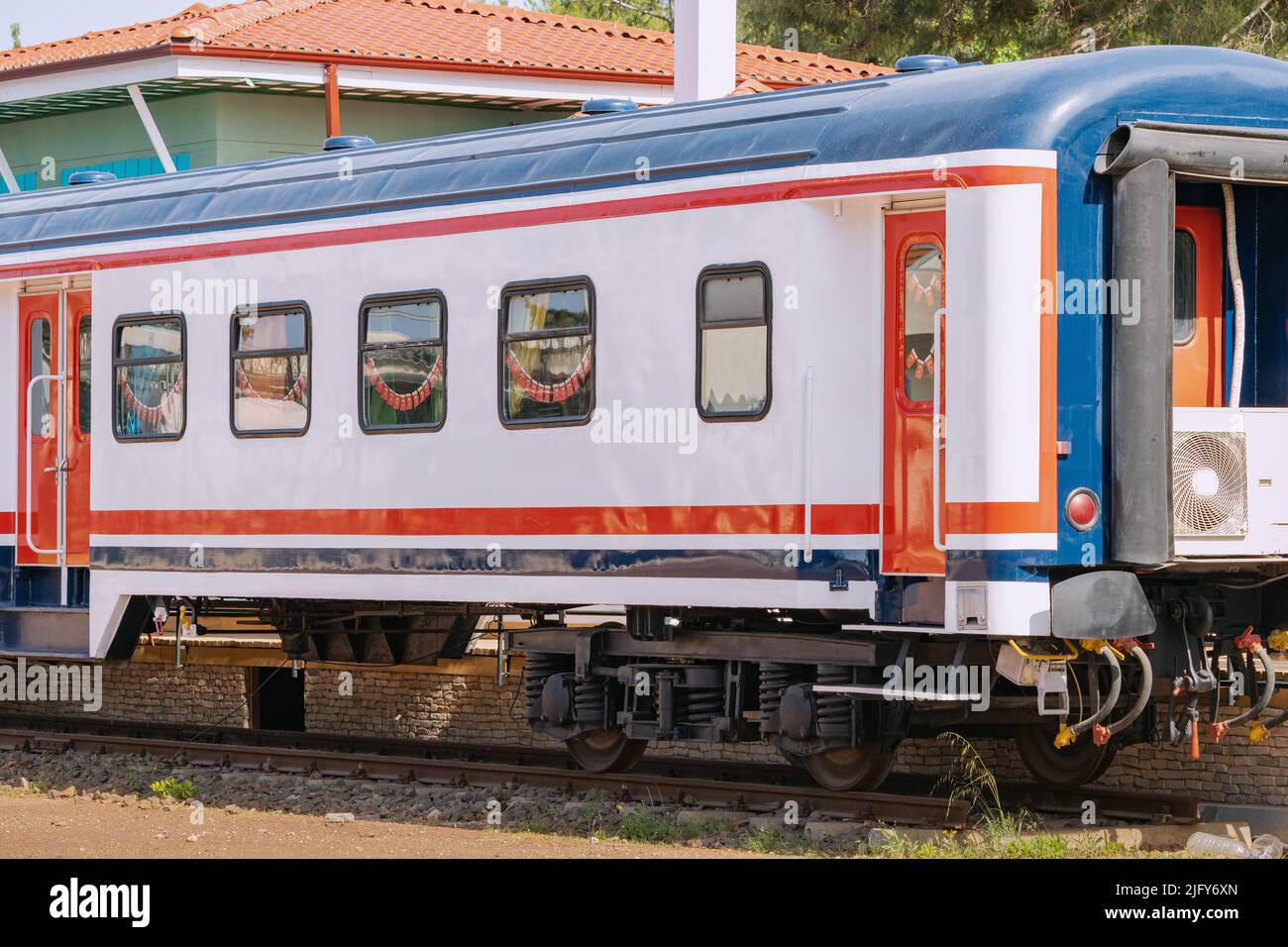 A retro tourist carriage of a Turkish train on the station platform ...