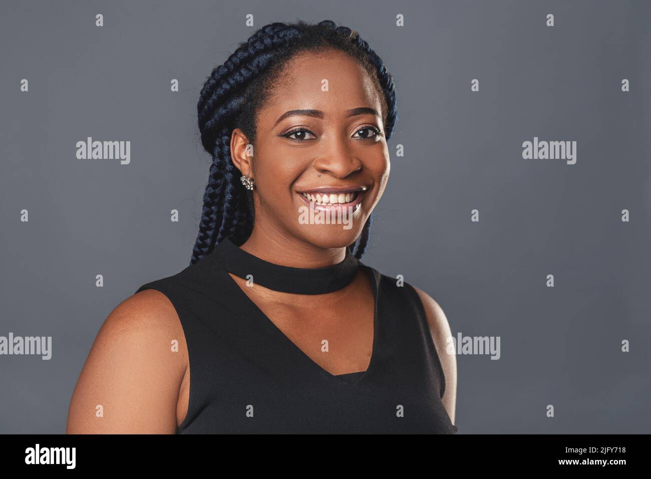 portrait of a young woman of ethnic African appearance. She looks at ...