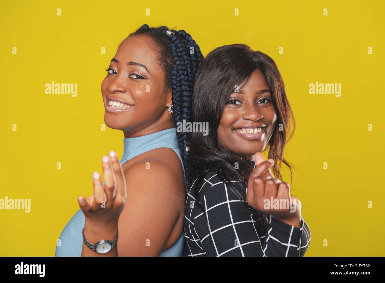 two beautiful afro american girls hugging and rejoicing and smiling on ...