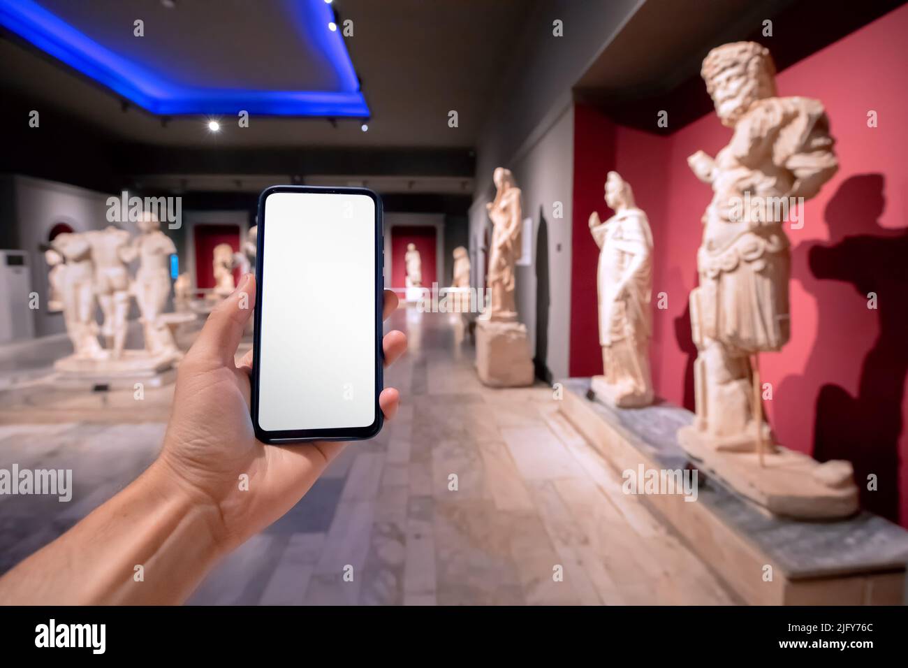 Smartphone with a blank screen in the interior of an archaeological ...