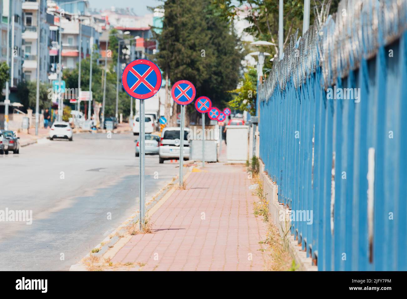 Many Road signs prohibiting parking and stopping. Traffic laws and ...