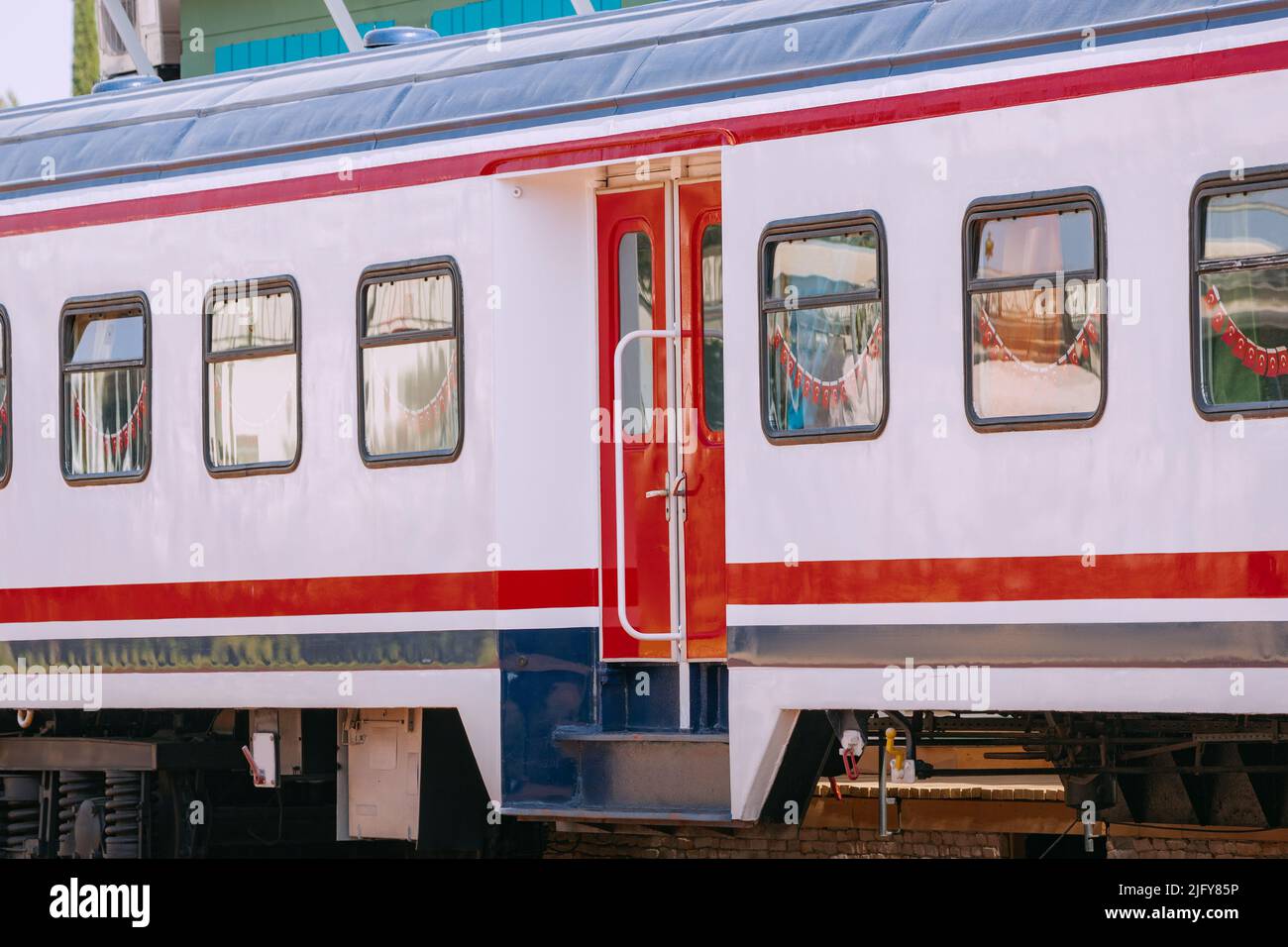 A retro tourist carriage of a Turkish train on the station platform ...