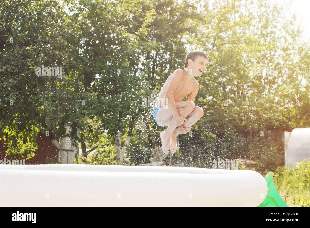 Little kid jumping swimming pool hi-res stock photography and images ...