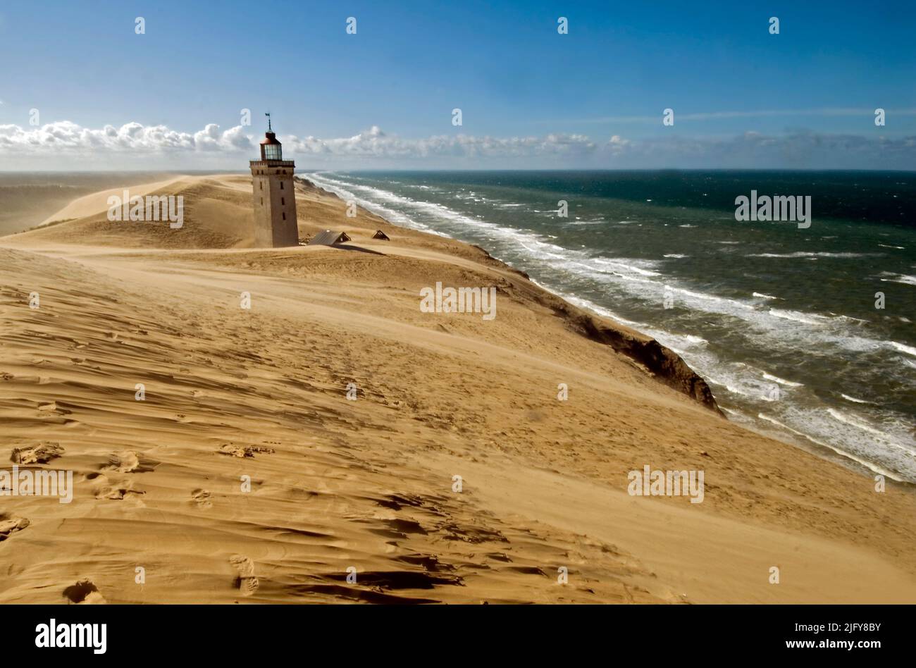 The Lighthouse at Rubjerg Knude is partly buried in the sand. A few years before this picture ...