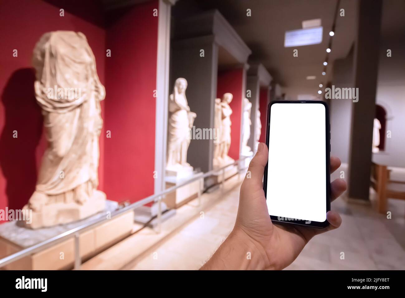 Smartphone with a blank screen in the interior of an archaeological ...