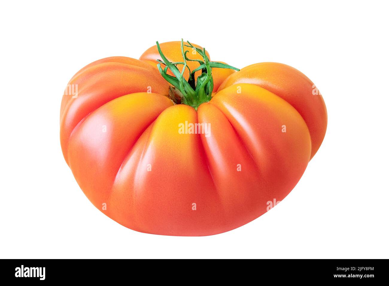 ribbed unusual delicious and juicy fresh tomato isolated on a white ...