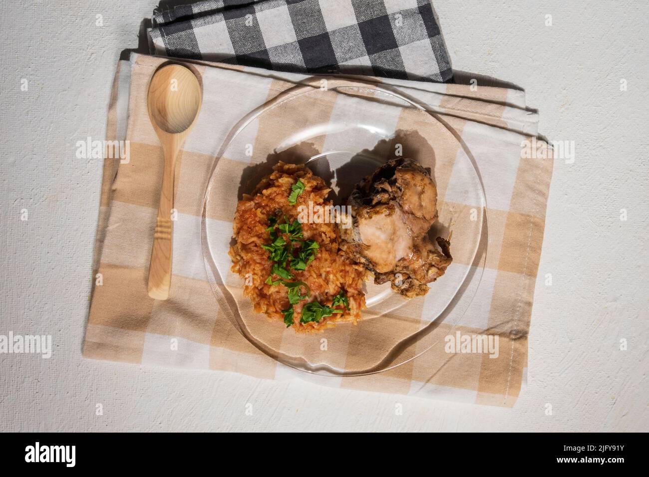 Nigerian food: Jollof rice with fried chicken close-up on a plate Stock ...