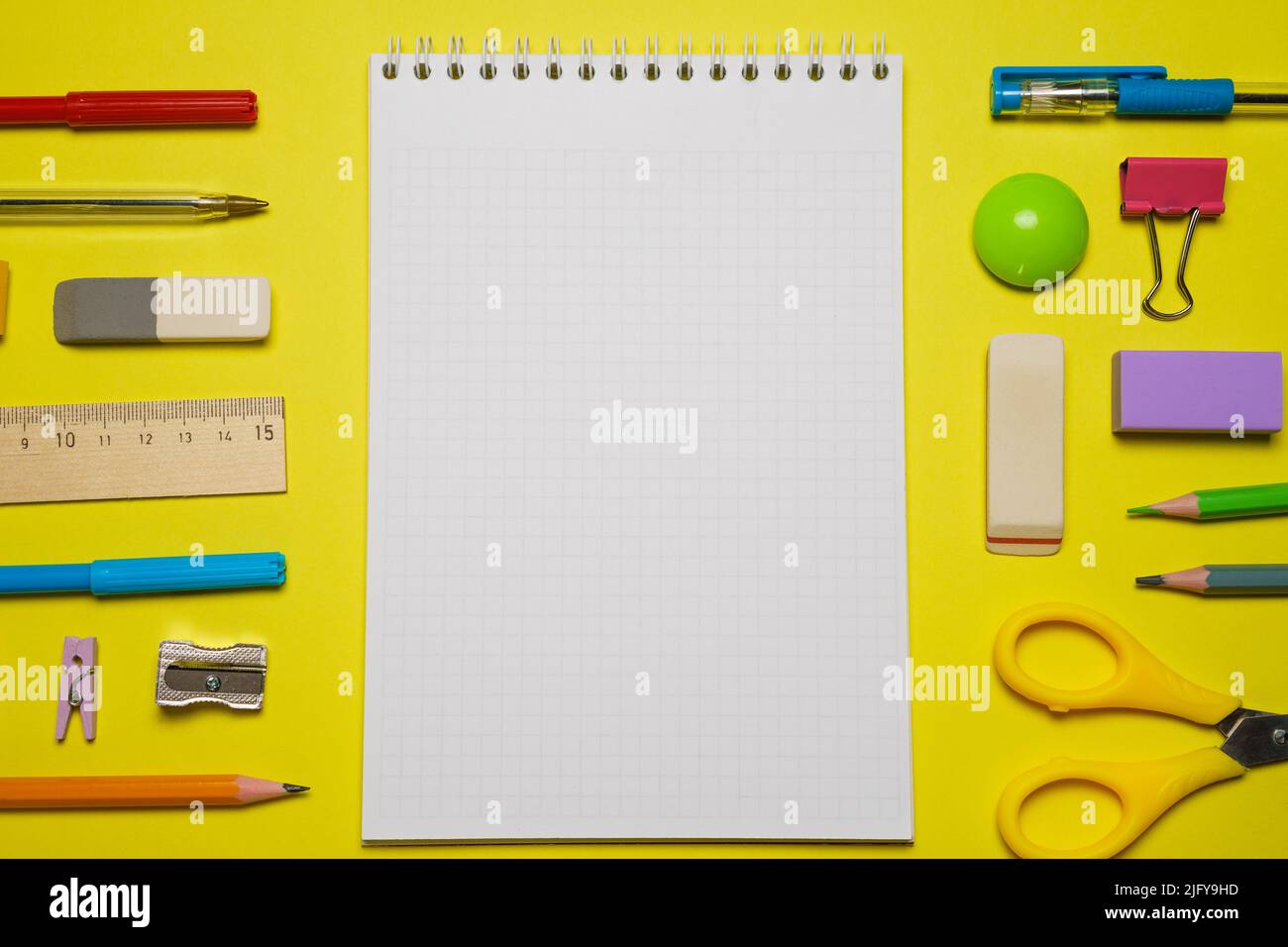 School notebook and various stationery. Back to school concept. Pencils ...