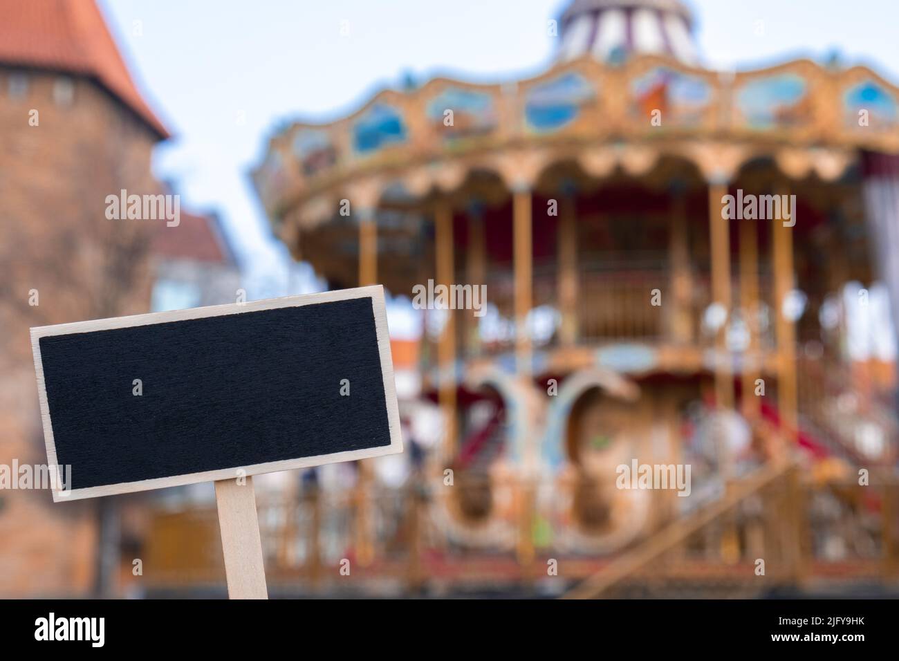 Empty mockup template Blackboard label against Carousel in amusement ...