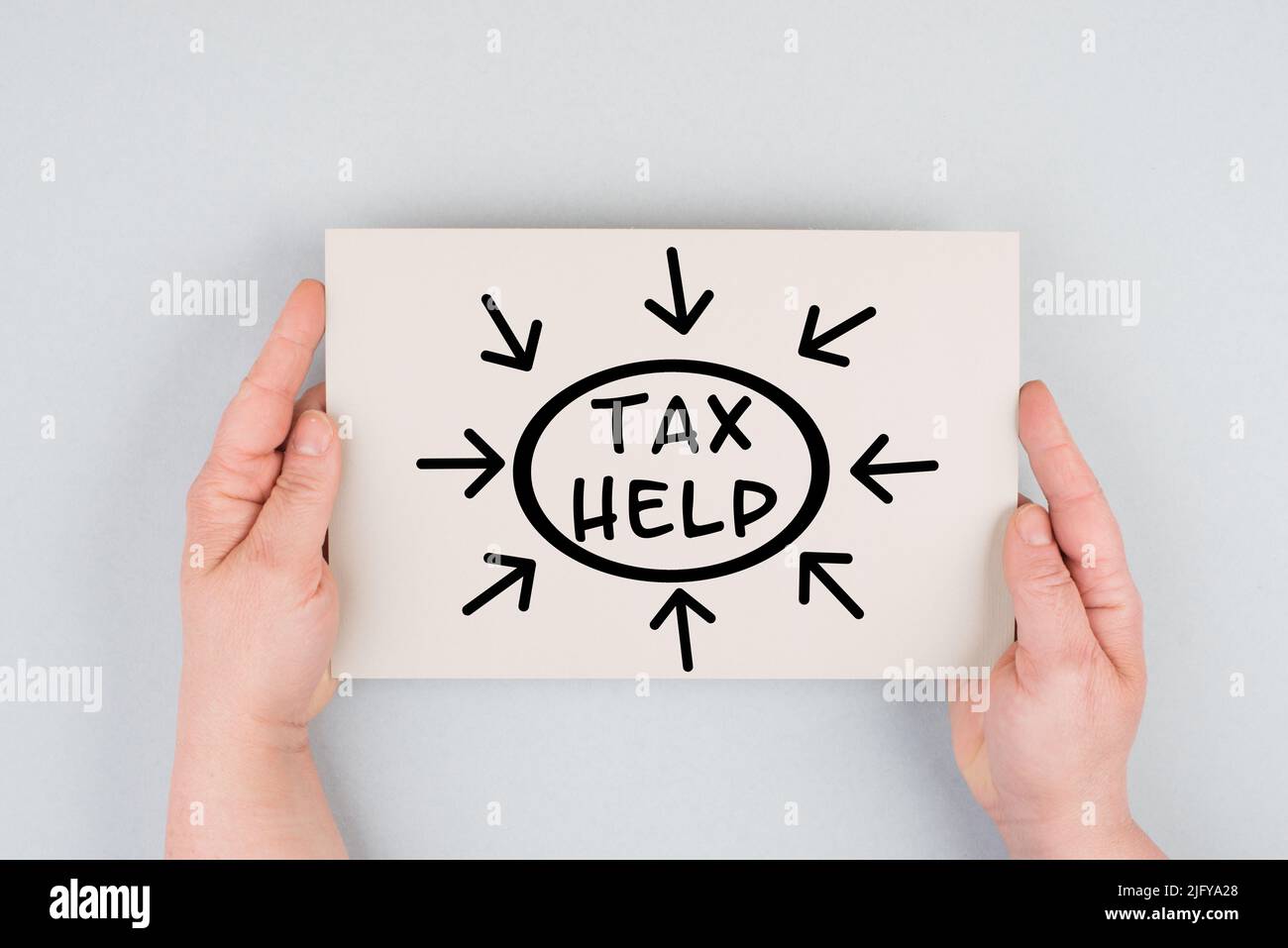 The words tax help are standing on a paper, financial support Stock ...