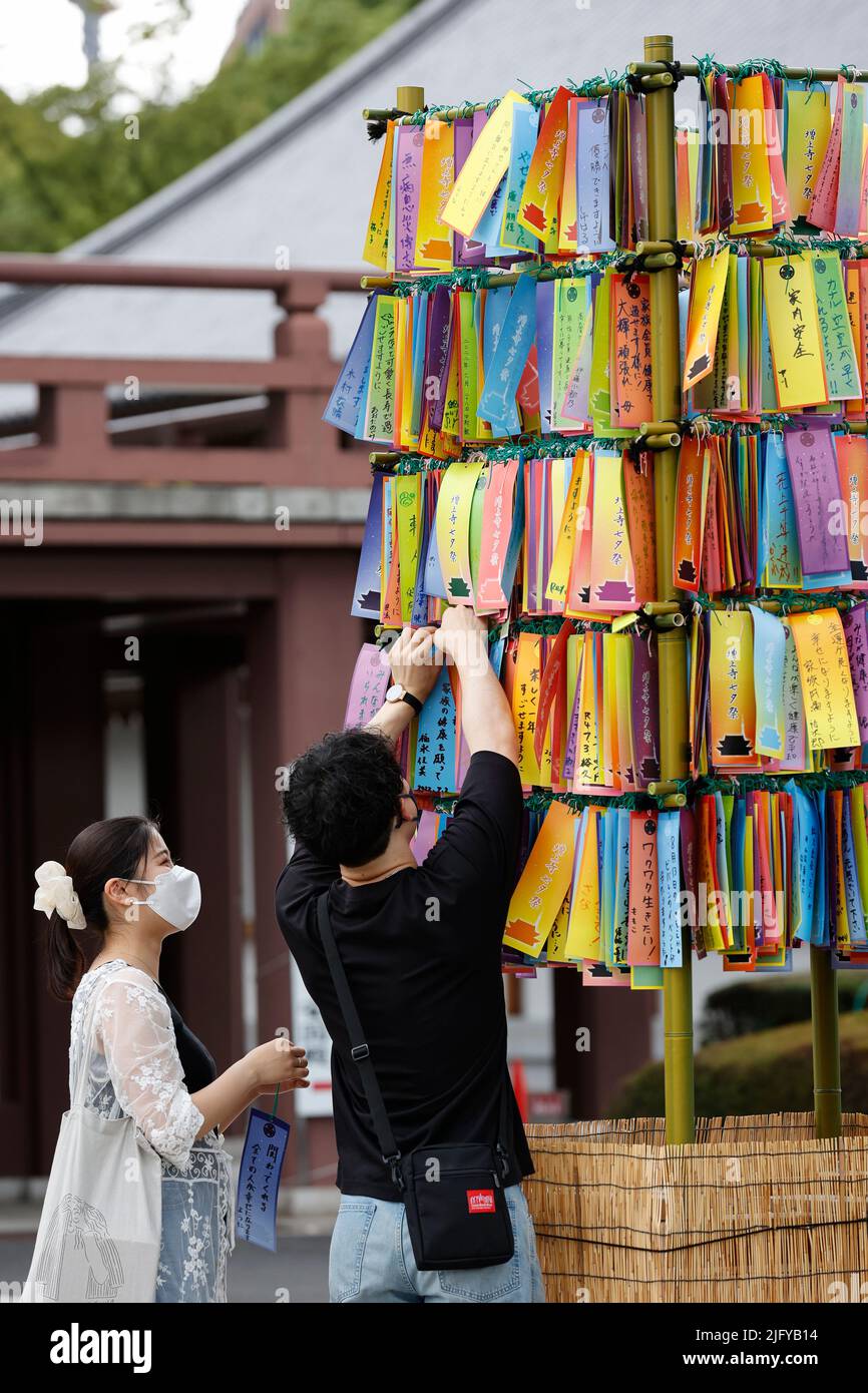 Tokyo, Japan. 6th July, 2022. Visitors hang their wishes on bamboo for ...