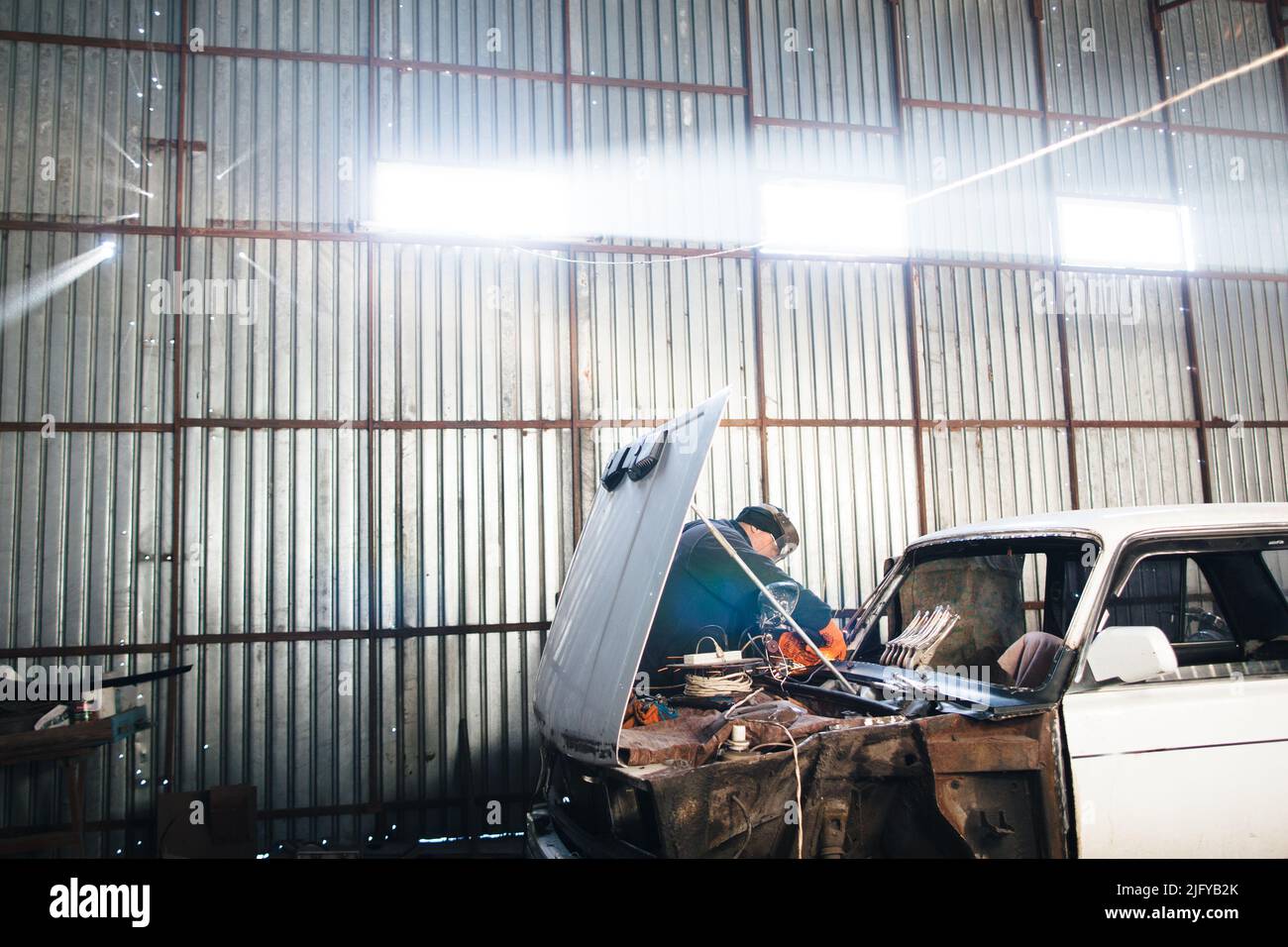 Mechanic repair and service car in garage Stock Photo - Alamy