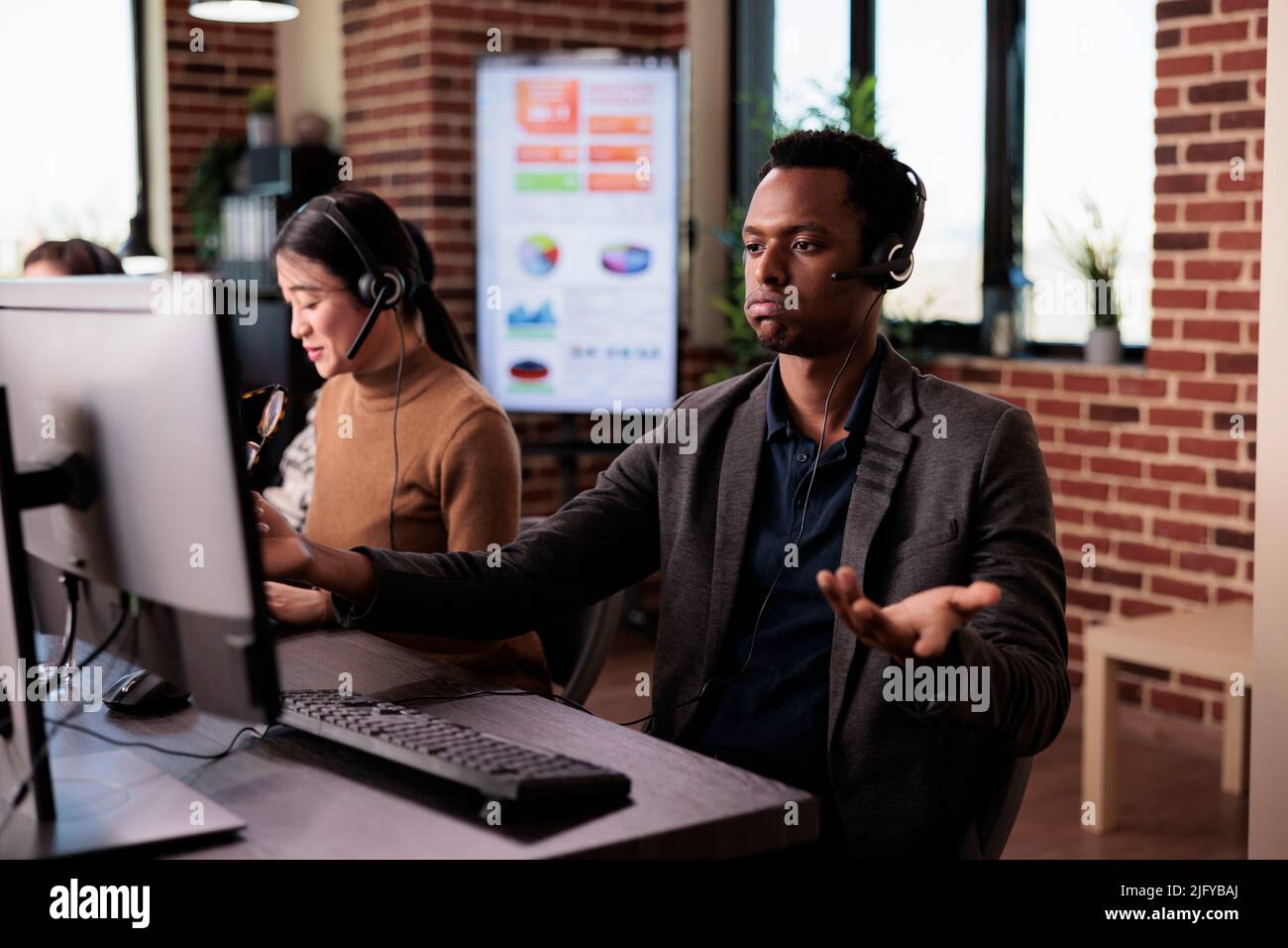 African american employee working at call center helpline support to ...