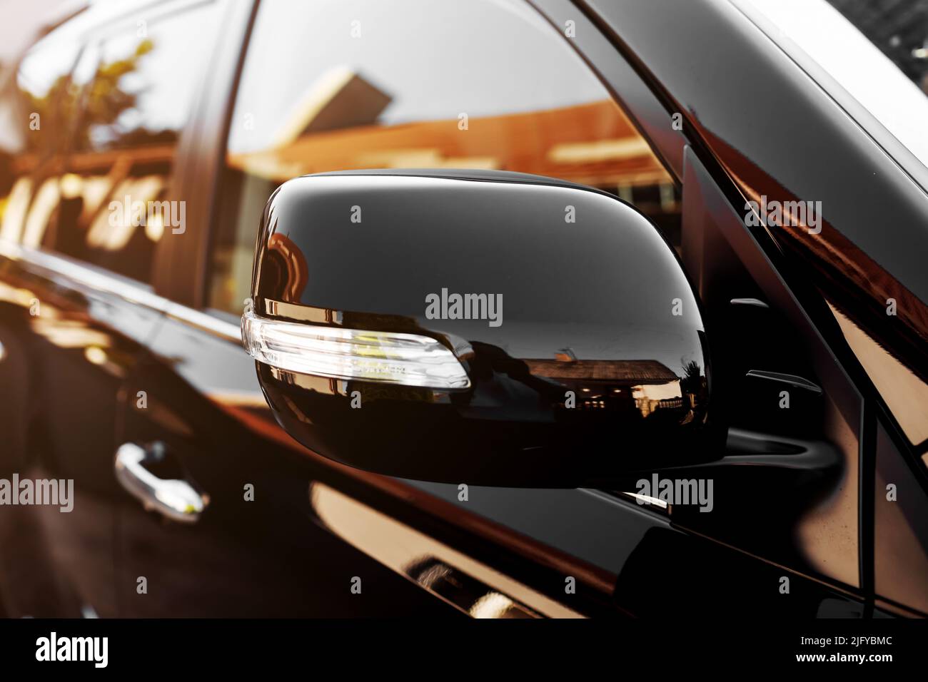 The rear view mirror on modern car on a black car. Rear view mirror car ... The rear view mirror on modern car on a black car. Rear view mirror car ...