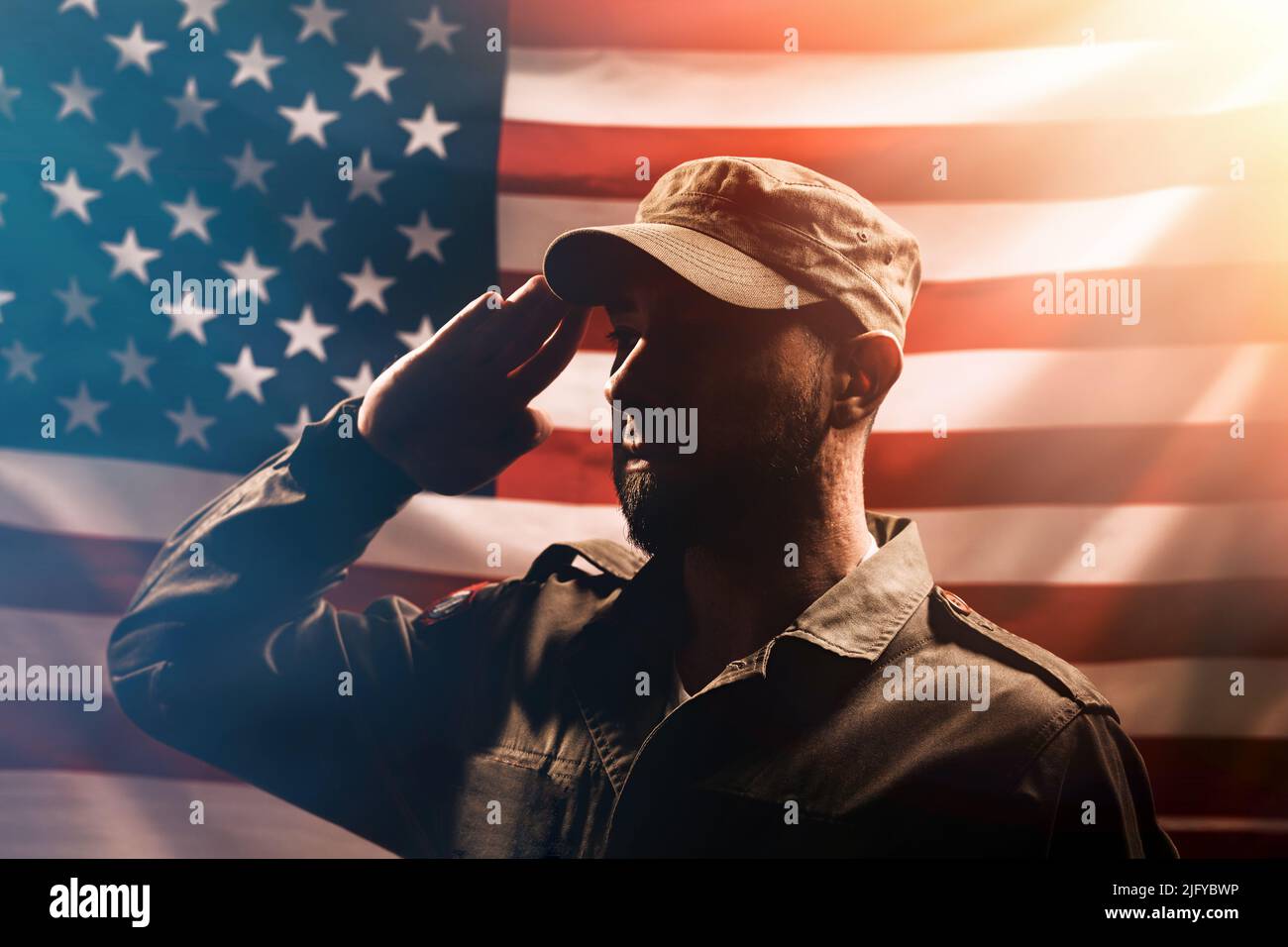 Memorial day. A uniformed soldier salutes against the background of the ...