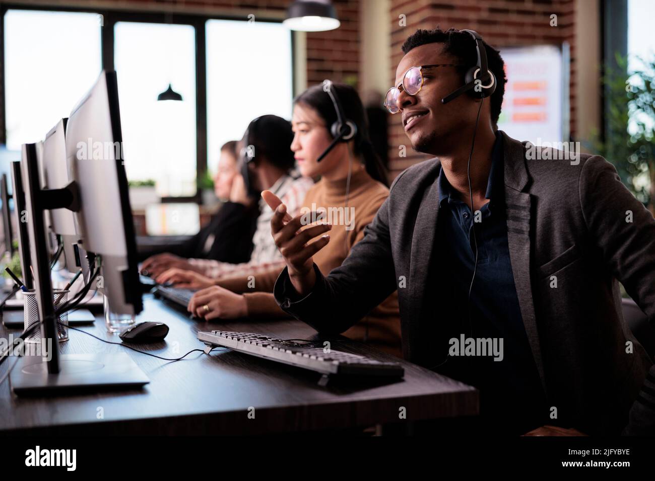 Reception secretary answering client phone call at customer service ...