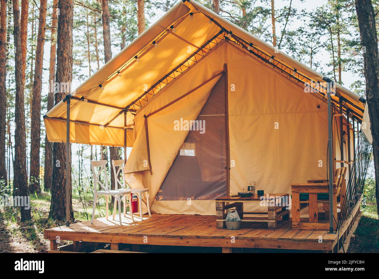 Path to glamping tent with view on woods. Camping and outdoor concept ...