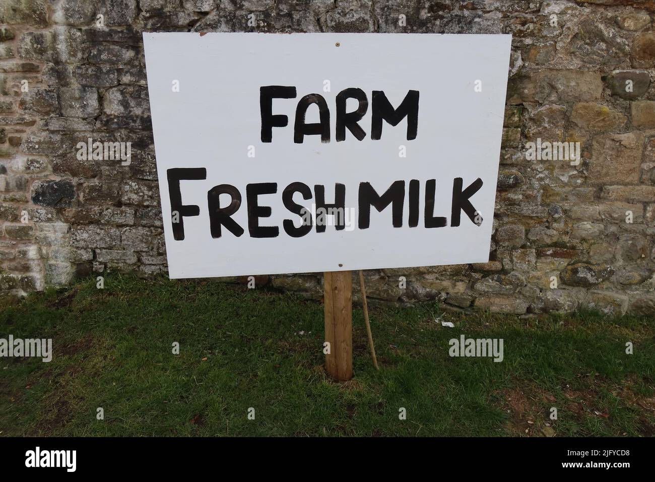 A farm fresh milk sign in Caldbeck village. The Cumbria Way Long ...