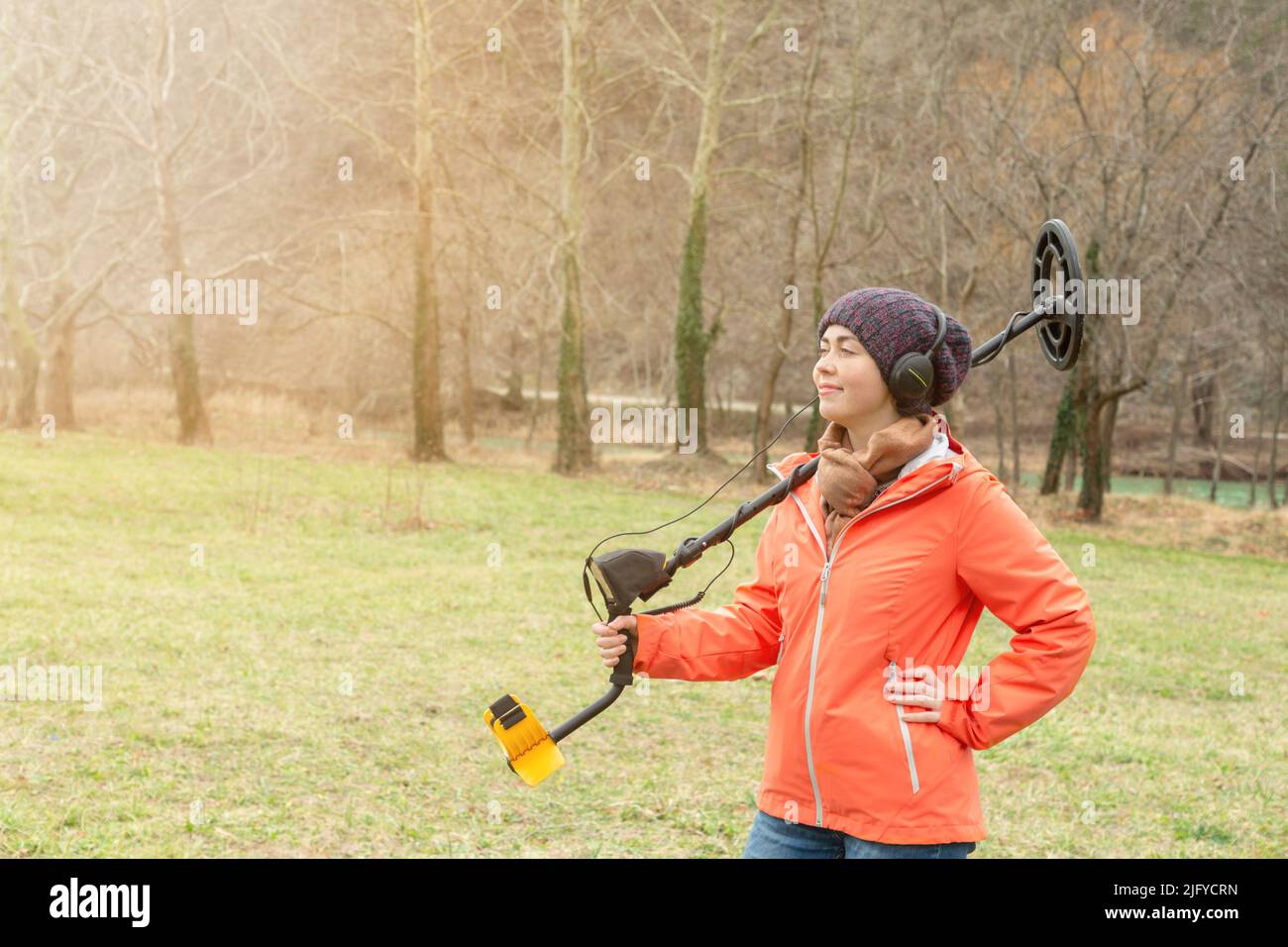 girl posing with a detector on the shoulder on the background of the ...