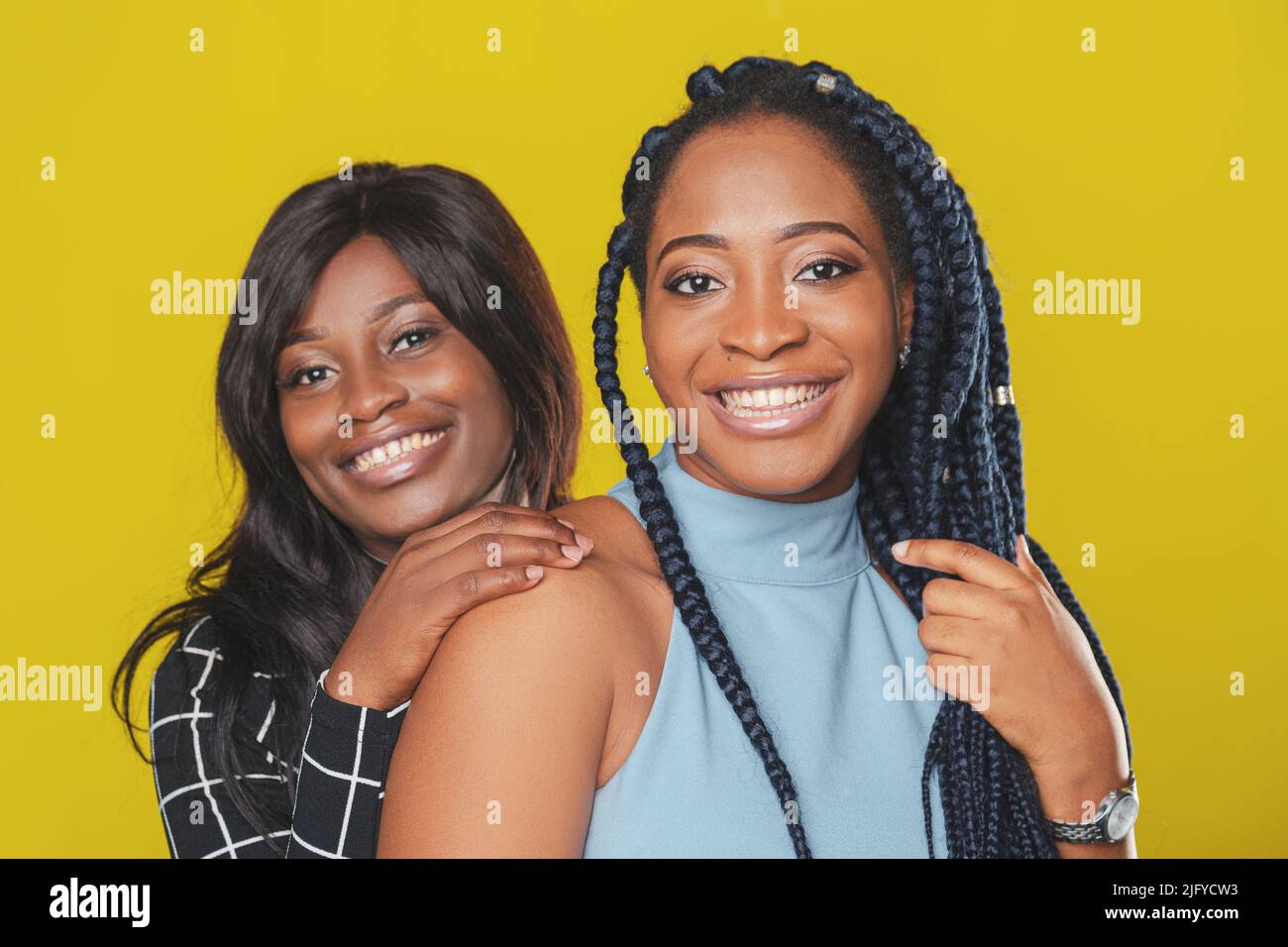 two beautiful afro american girls hugging and rejoicing and smiling on ...