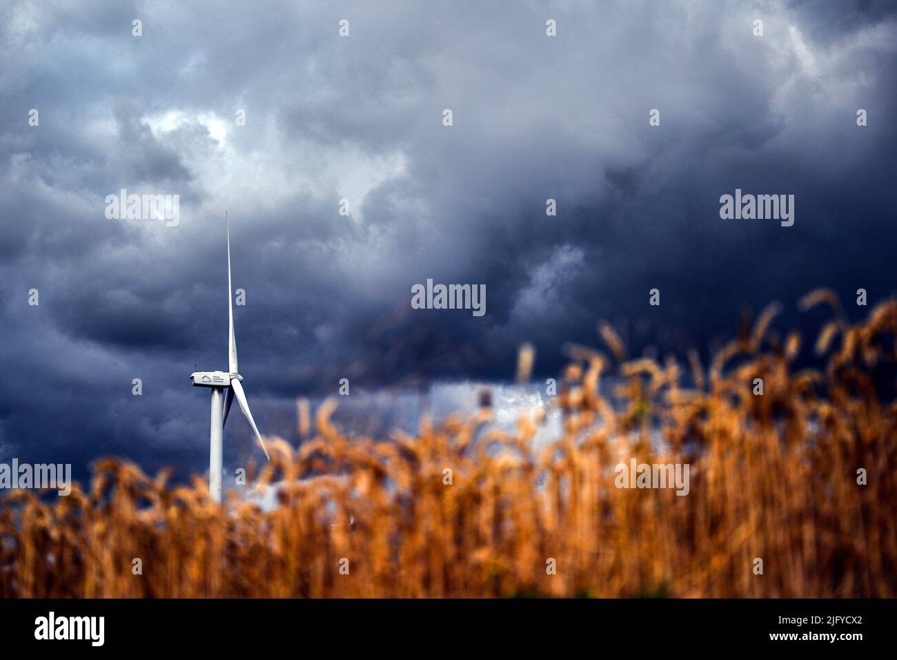 Stommeln, Germany. 06th July, 2022. Clouds pass over a wind turbine ...