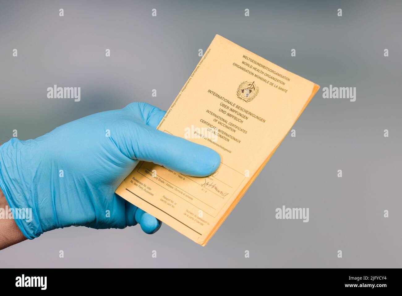 doctor's hand with document of international certificates of ...