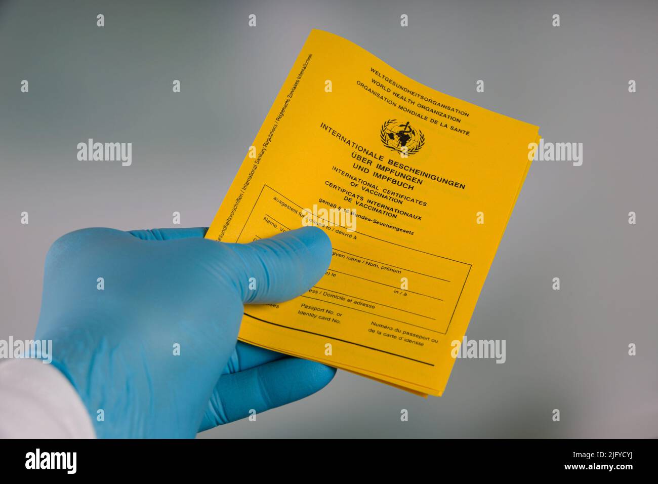 doctor's hand with document of international certificates of ...