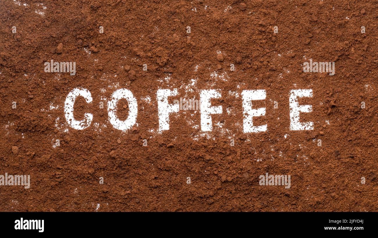 Close up ground coffee from coffee machine isolated on white background ...