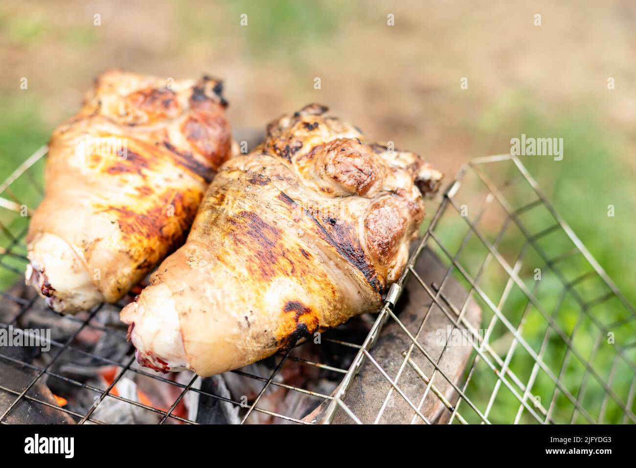Close up grilled pork leg on stove before stewed pork leg. Thai style ...