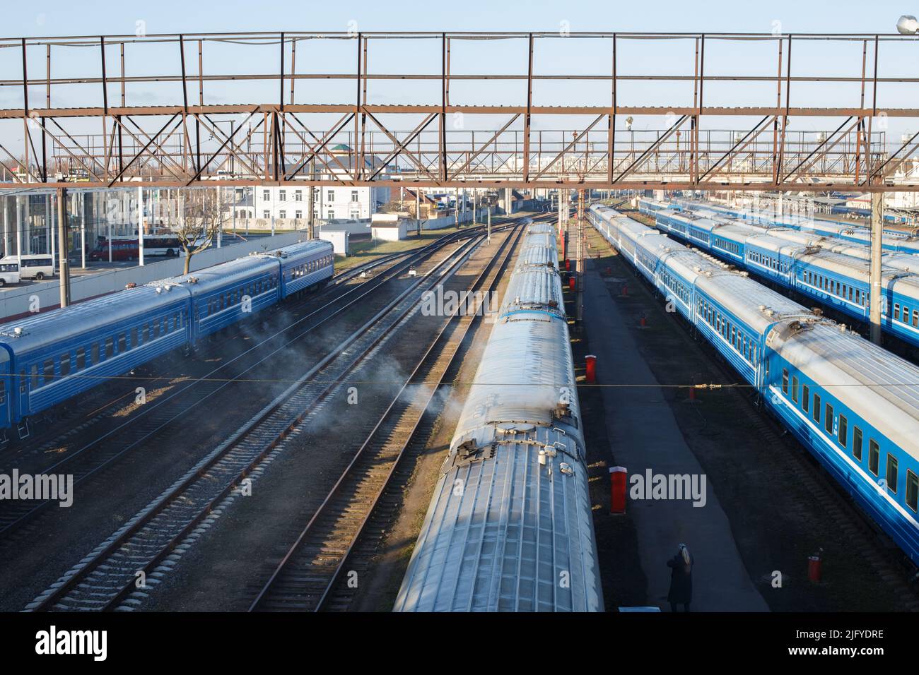 Cargo freight station with a many passenger trains Stock Photo - Alamy