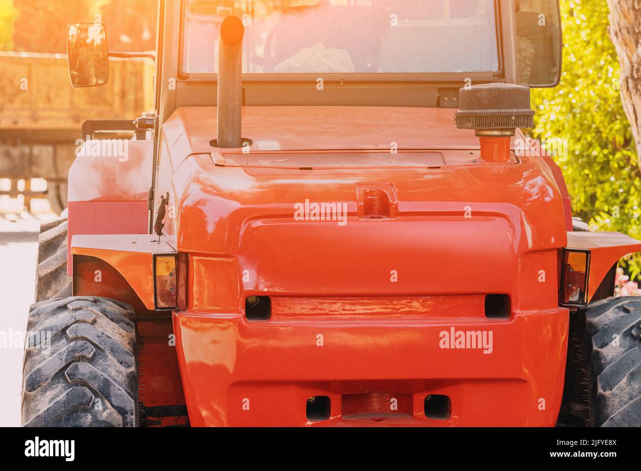 Red powerful tractor close-up. Heavy machinery for industrial and ...