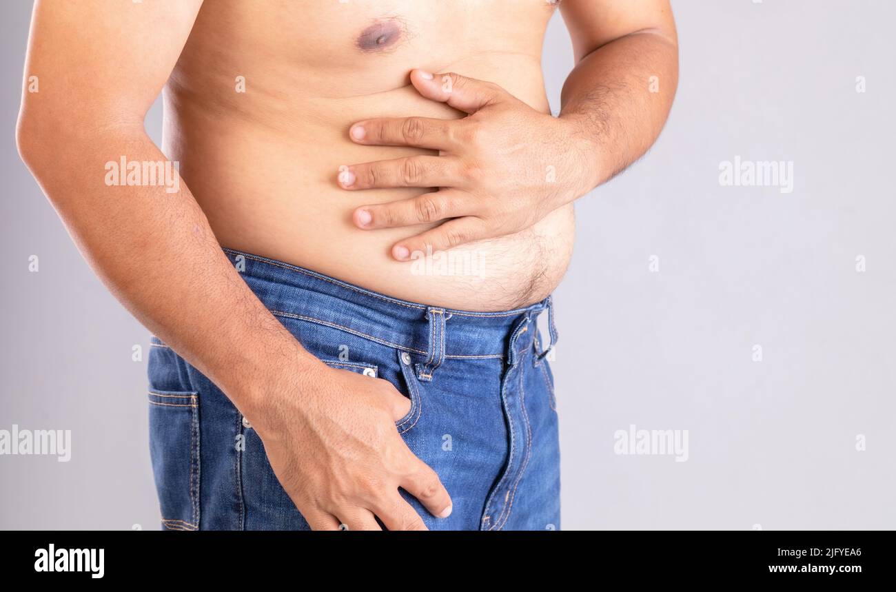 Stomach ache or pain on belly concept : Fat man using his hand and ...