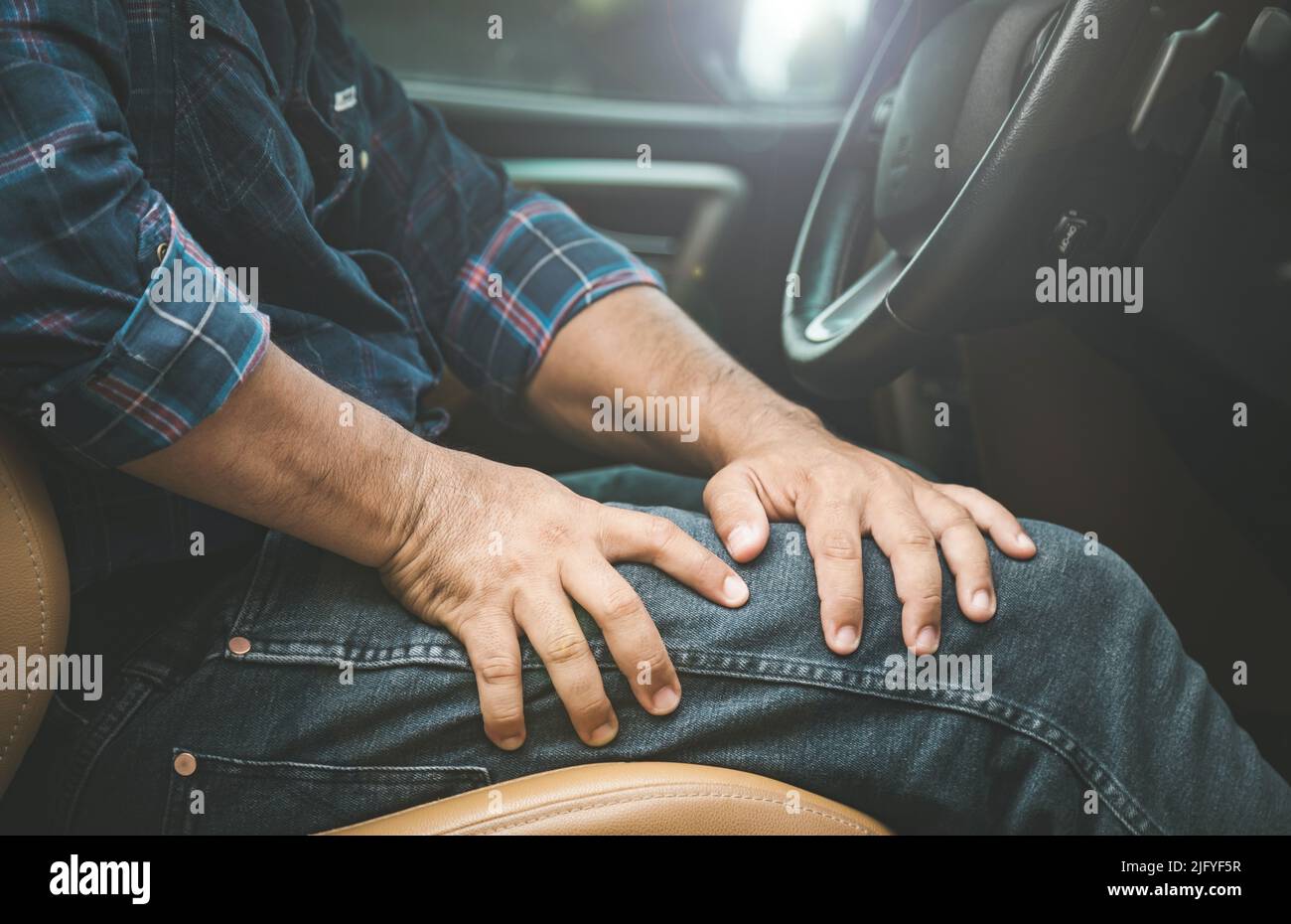 Injury or tired from long driving concept : Man use hands to hold and ...