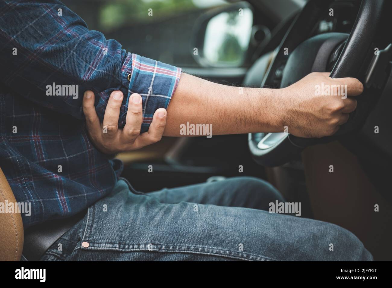 Injury or tired from long driving concept : Man use hands to hold and ...