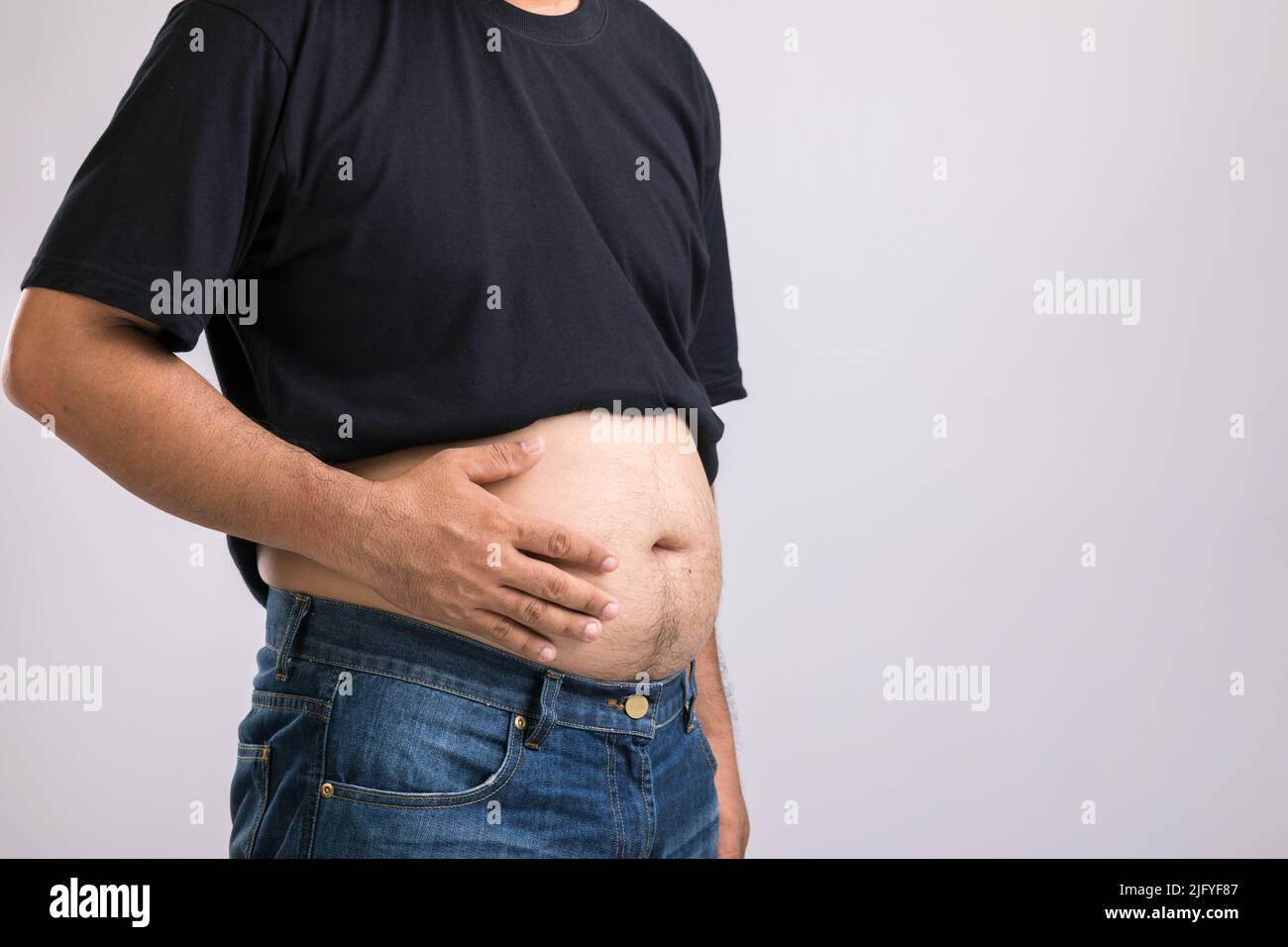 Medical check up concept : Fat people showing his big belly. Used for ...