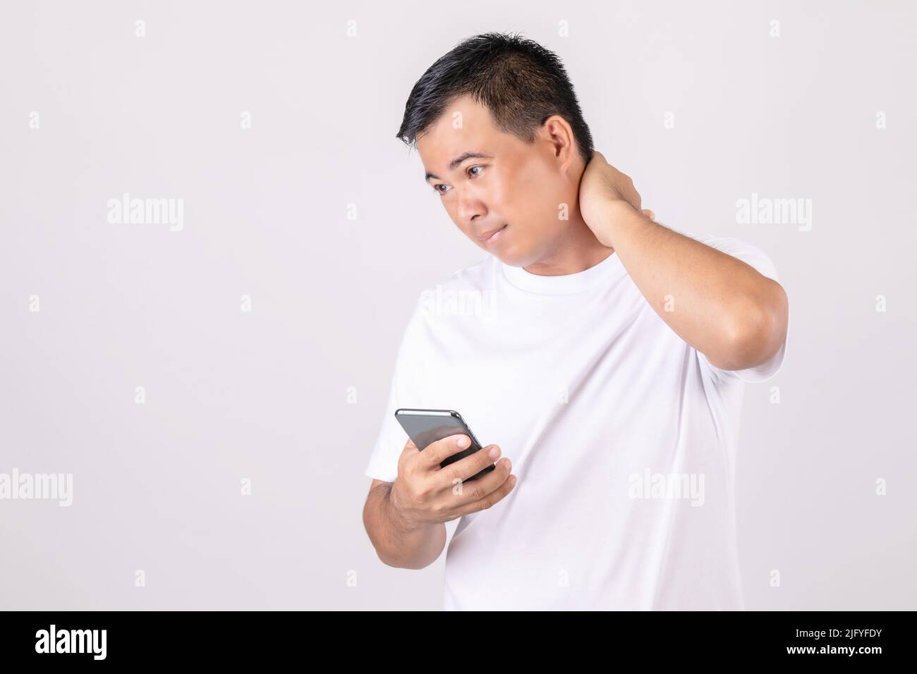 Neck pain concept. Man touching his neck because pain or hurt after ...