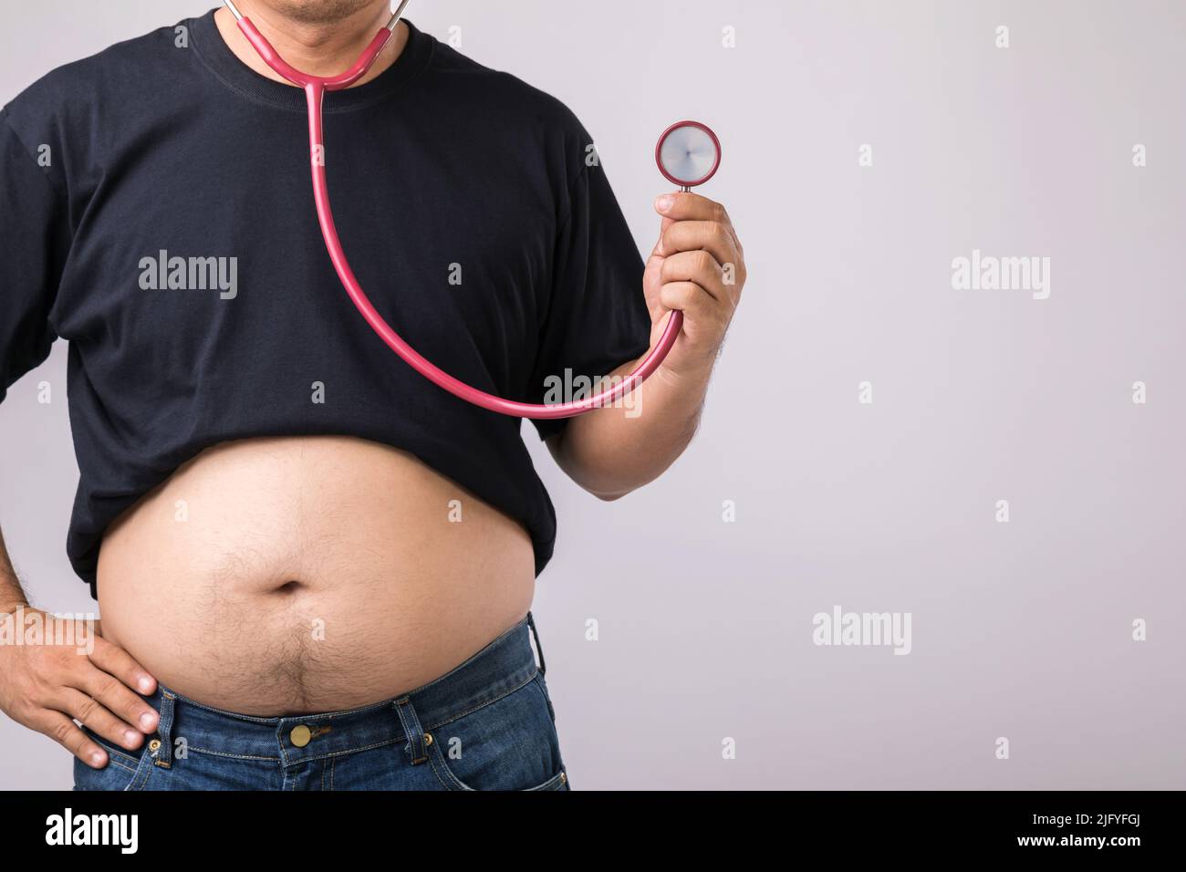 Medical Check up concept : Fat people holding red doctor stethoscope ...