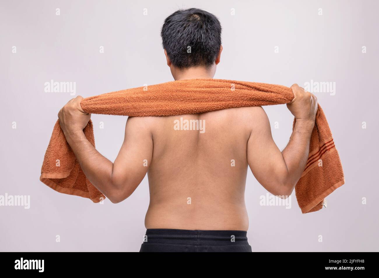Close up man holding towel to rub the body dry after shower. To used ...